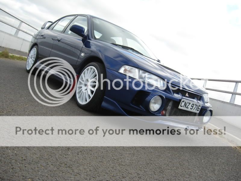 Gun Blue Car White Rims